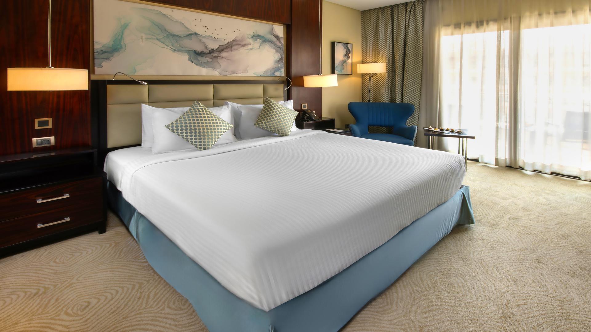 Deluxe Room Pool View | Triumph Luxury Hotel